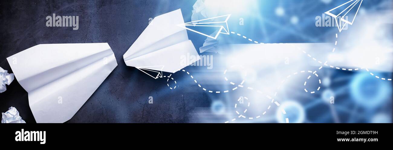 Paper airplane on the table. Origami model on a dark background ...