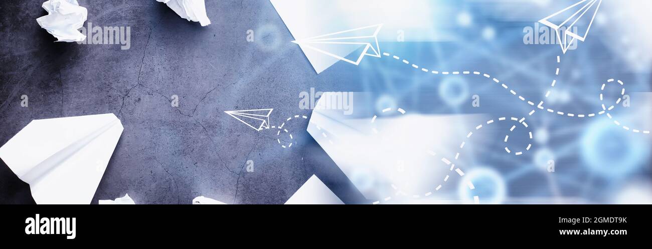 Paper airplane on the table. Origami model on a dark background ...