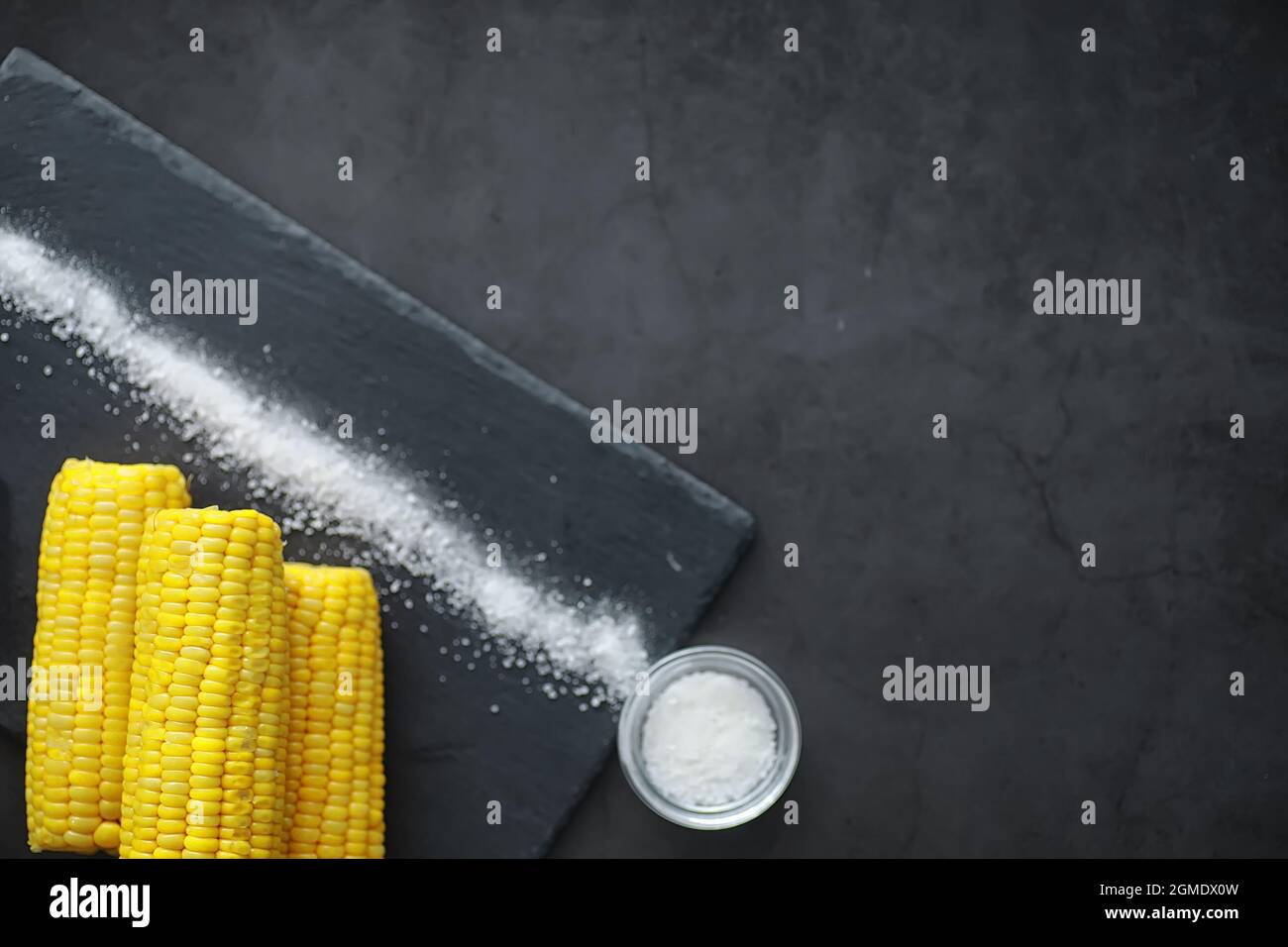 Freshly made fragrant ear of corn with salt. Farm snack fresh corn ...