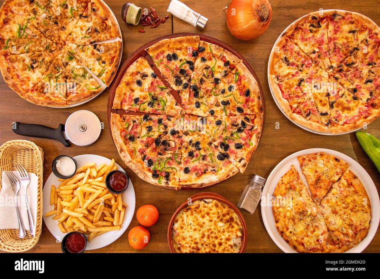 Top view image of typical Italian dishes, assorted sliced pizzas ...
