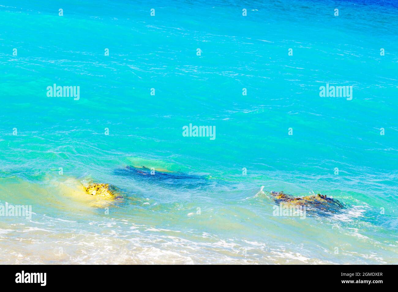 Turquoise blue clear water and and rocks at Kremasti beach on Rhodes ...