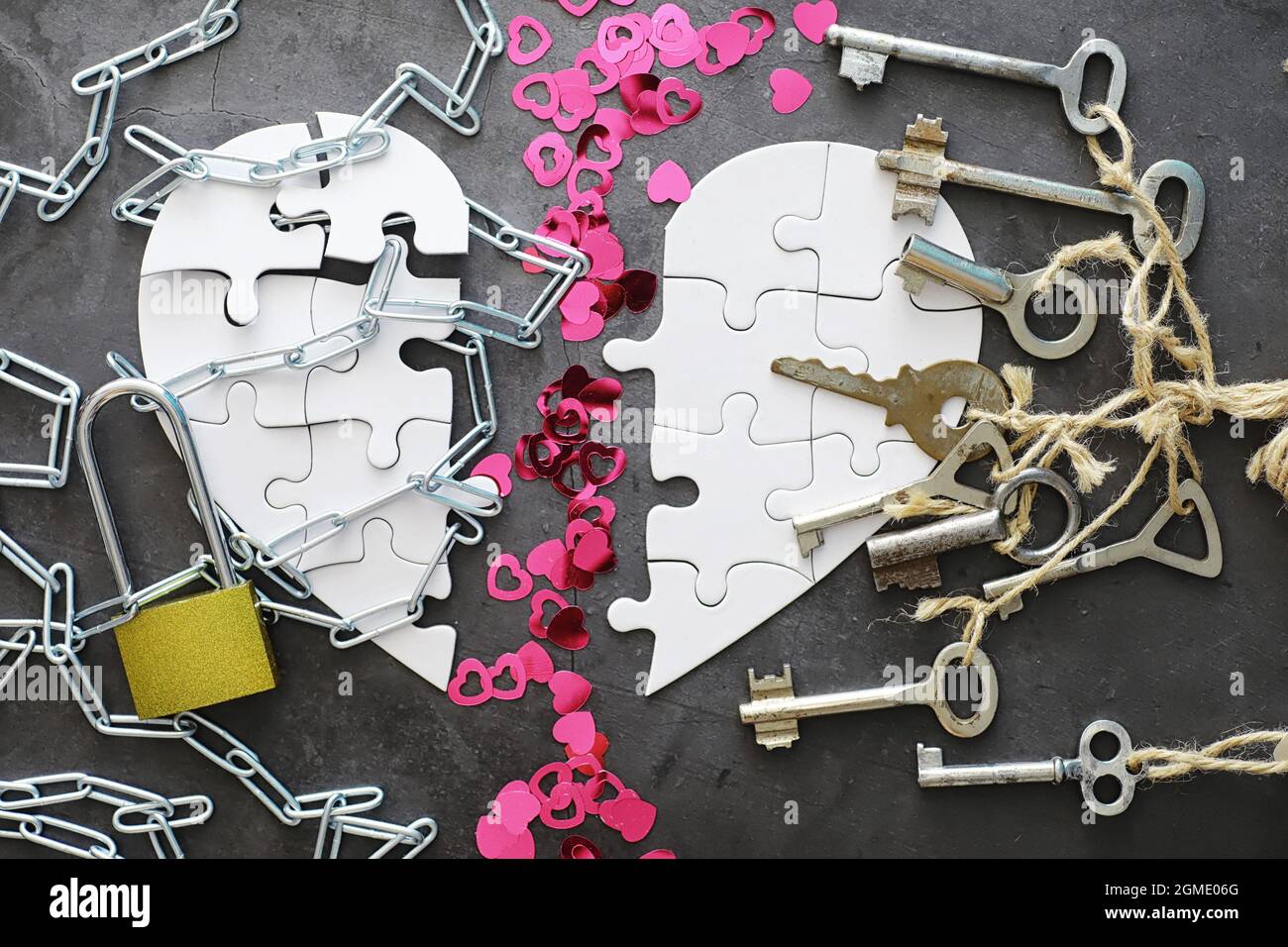 White heart-shaped puzzle. Heart affairs. Undivided love. Broken heart ...