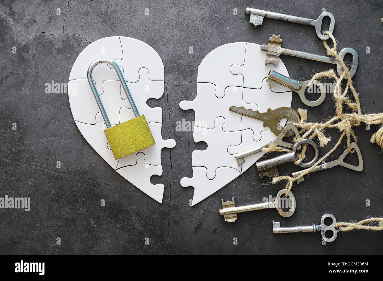 White heart-shaped puzzle. Heart affairs. Undivided love. Broken heart ...