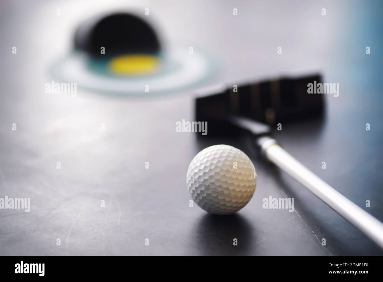 Sport and healthy lifestyle. Mini golf. White golf ball and set ...