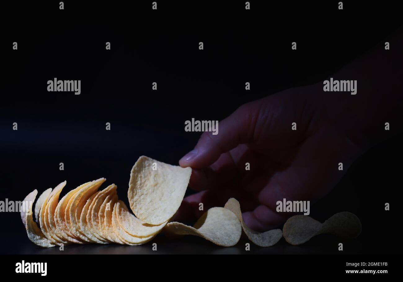 Potato and corn chips. Snacks salty appetizer. Harmful products ...