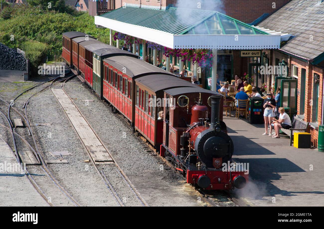 A train waits at Tywyn Wharf Station at the The Talyllyn Railway ...