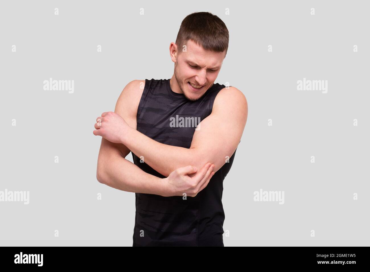 Sport man Holding Elbow. Man Having Injury. Sport man Elbow injury ...