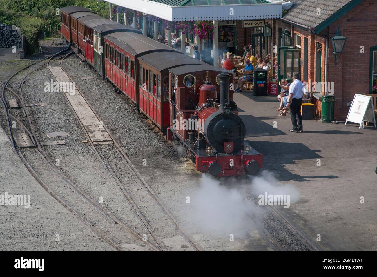 A train waits at Tywyn Wharf Station at the The Talyllyn Railway ...