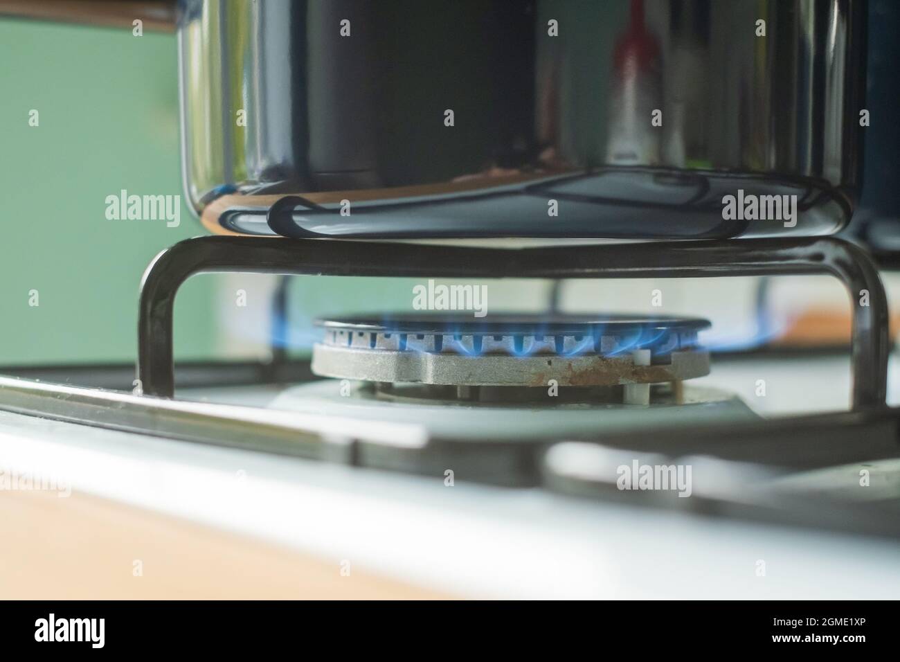 Peparing food on gas at home. Gas burner for a large pan Stock Photo ...