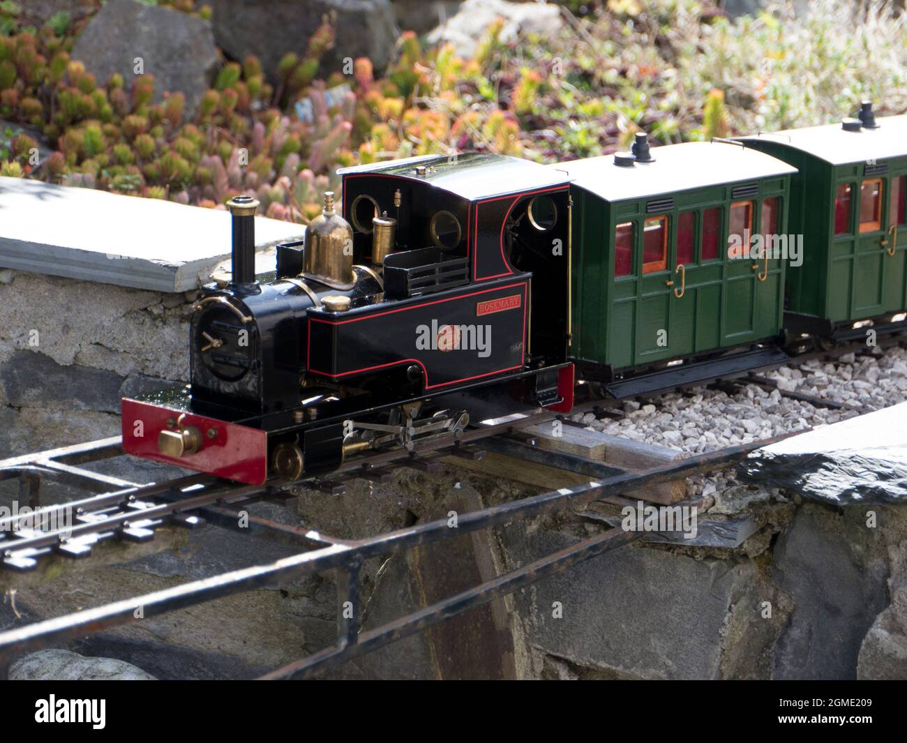 Garden Model Railway locomotive with carriages Stock Photo - Alamy