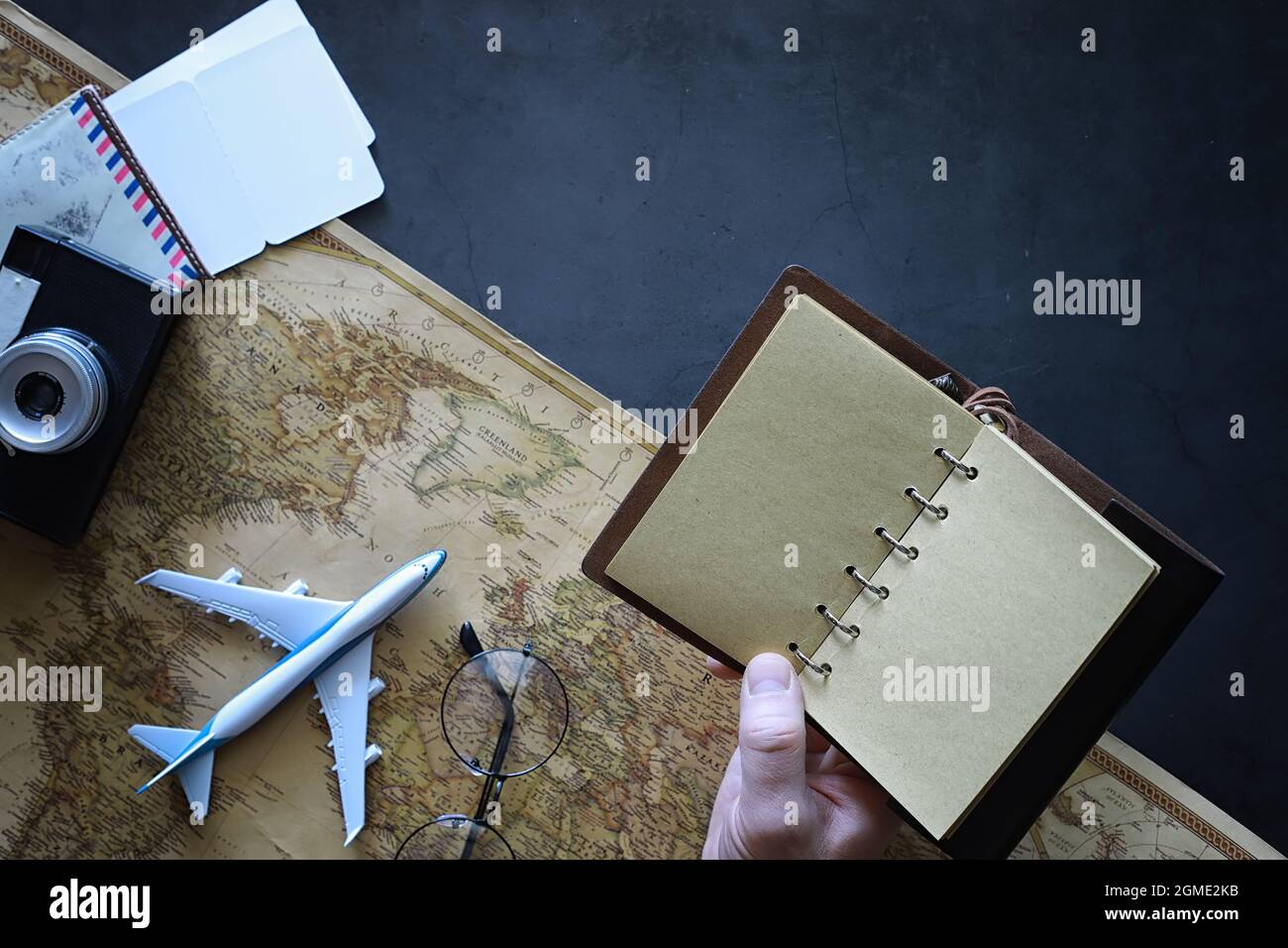 Travel concept. Map on the table and model aircraft Stock Photo - Alamy