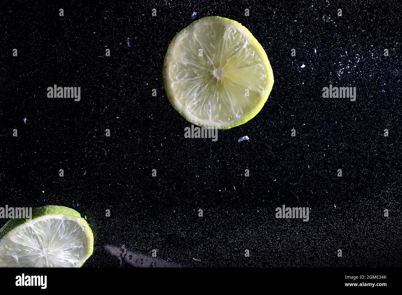 Water drops on ripe sweet lemon. Fresh lime background with copy space ...