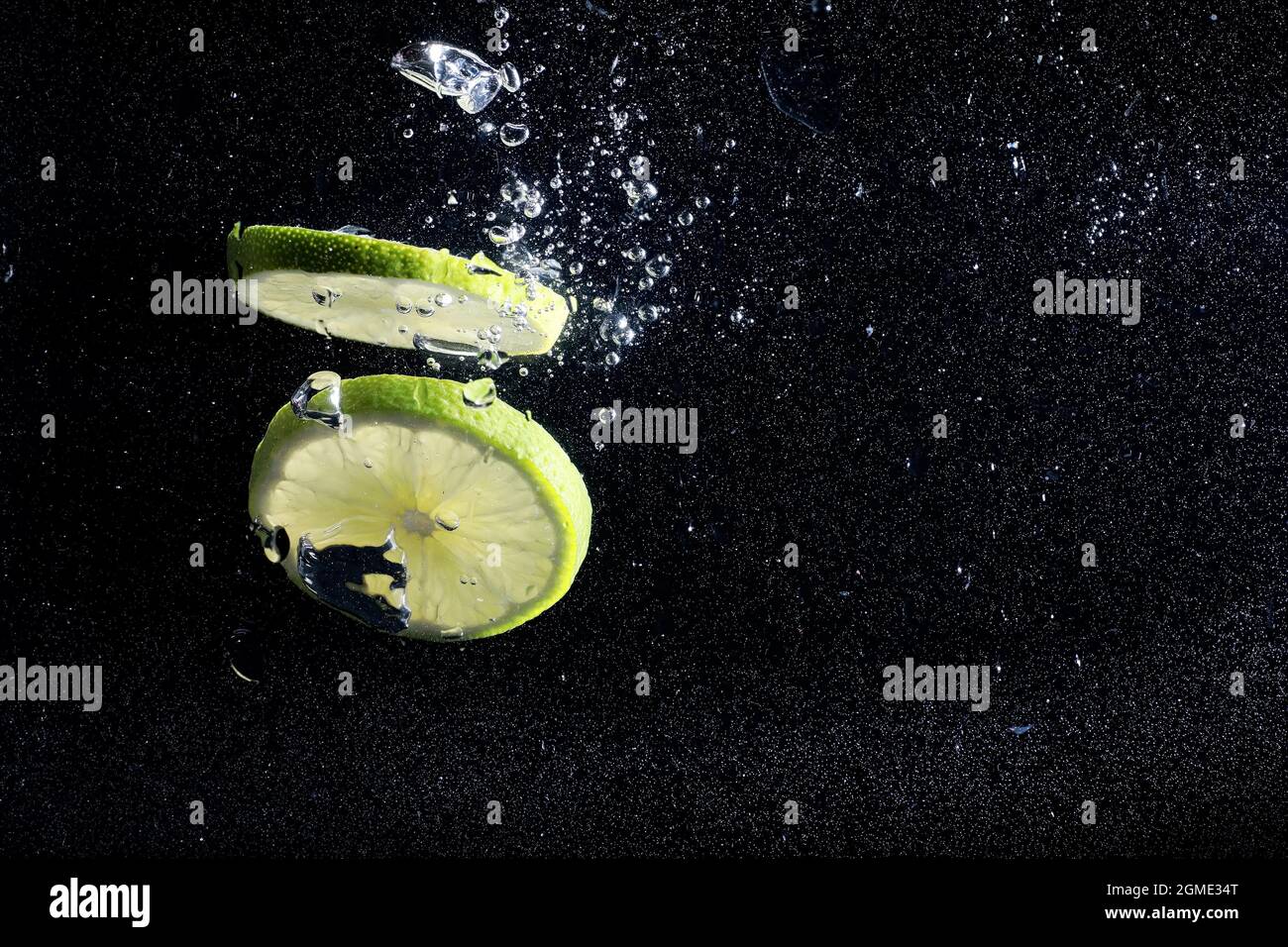 Water drops on ripe sweet lemon. Fresh lime background with copy space ...