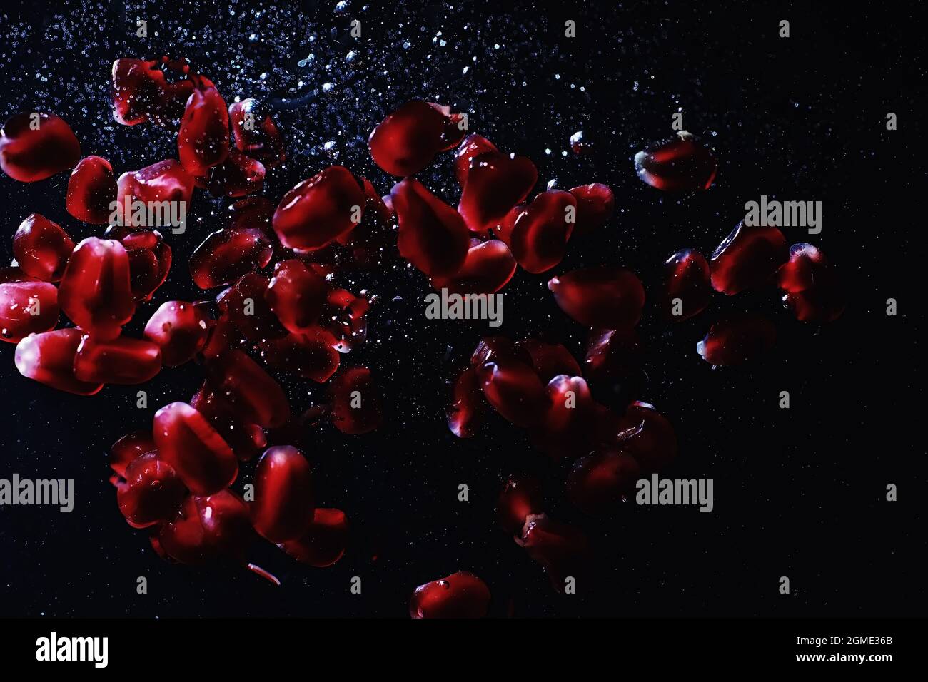 Water drops on ripe sweet pomegranate seeds. Fresh pomegranate ...