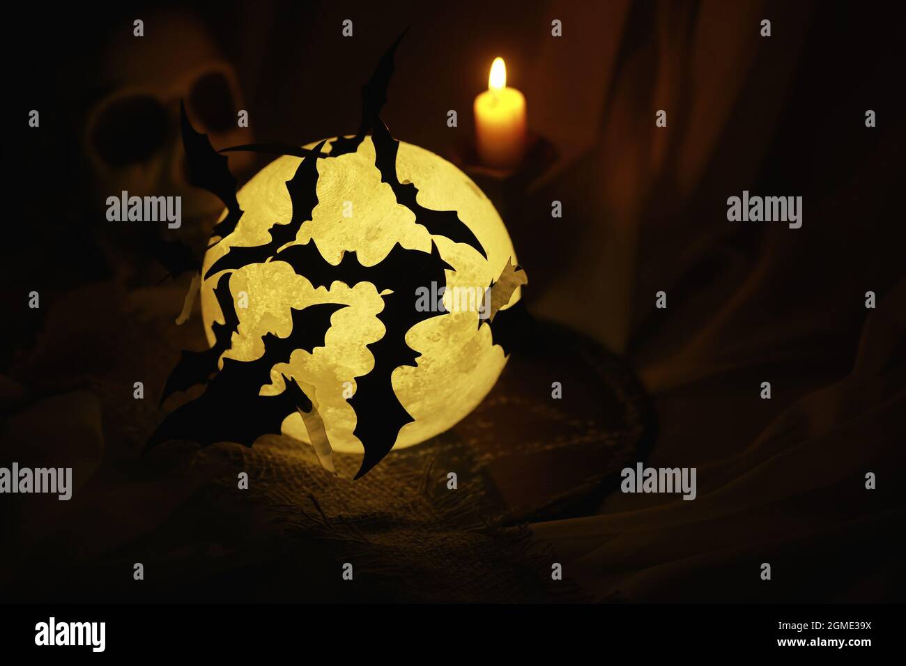 Black silhouettes of bats on background of the moon. Halloween concept ...