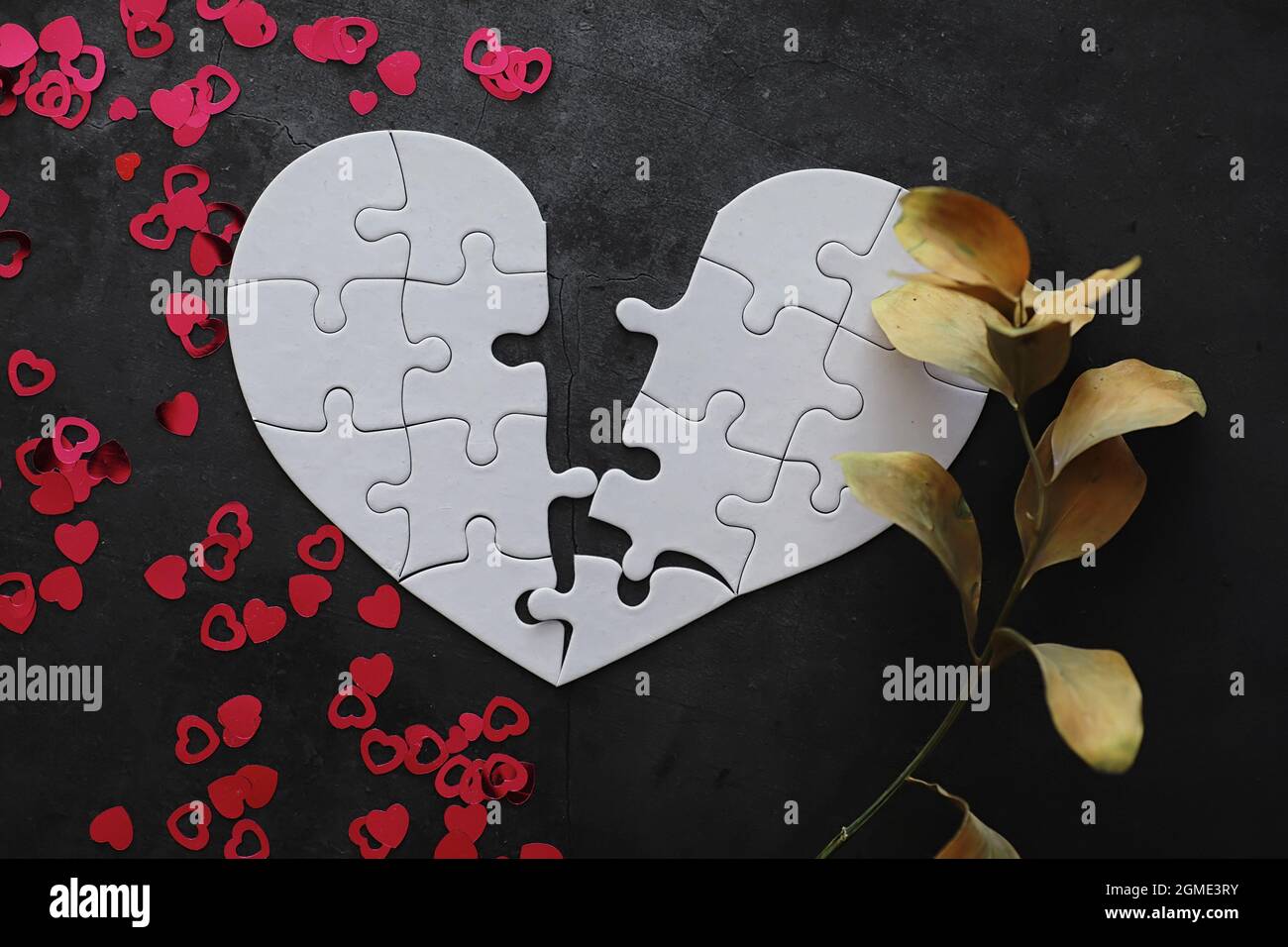 White heart-shaped puzzle. Heart affairs. Undivided love. Broken heart ...