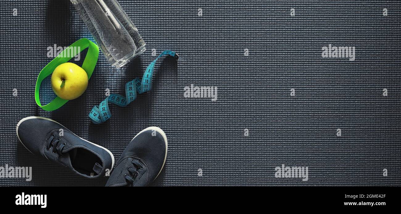 Mat for practicing yoga on a floor. Healthy lifestyle Stock Photo - Alamy