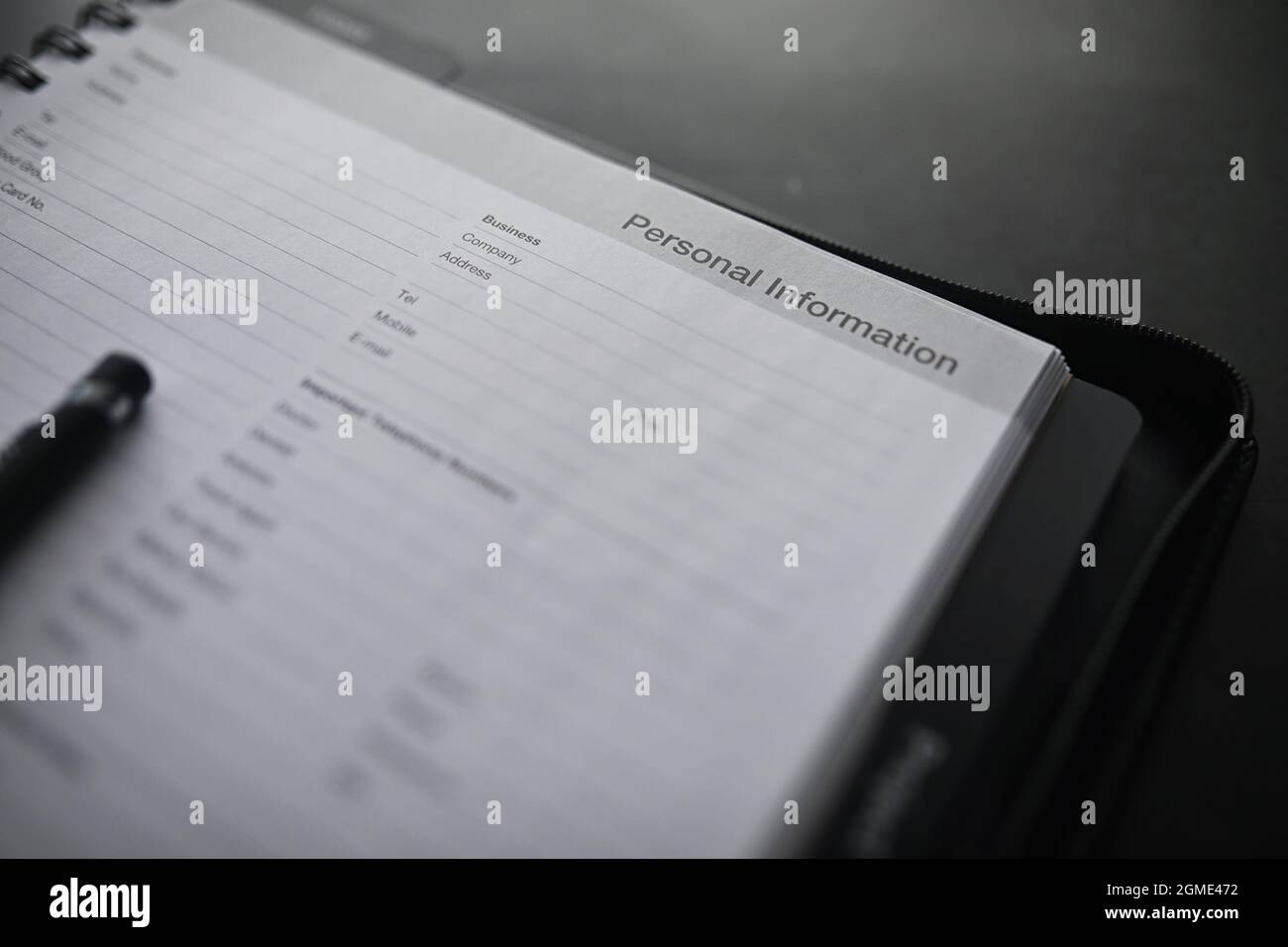 Filling out a form with personal information. Documents in a folder on ...