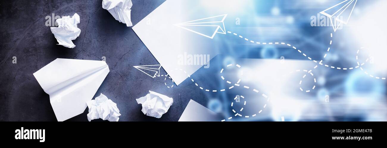 Paper airplane on the table. Origami model on a dark background ...