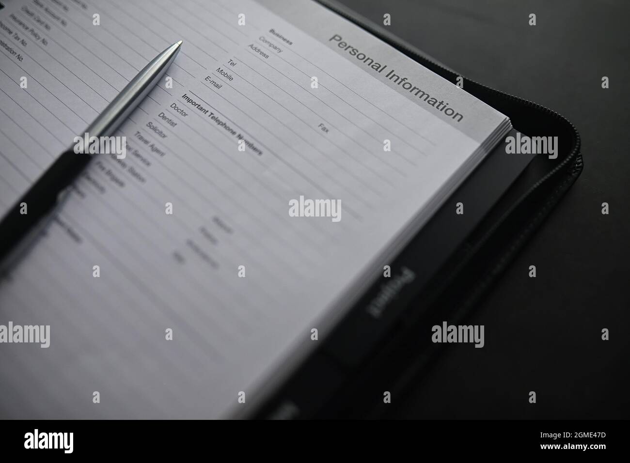 Filling out a form with personal information. Documents in a folder on ...