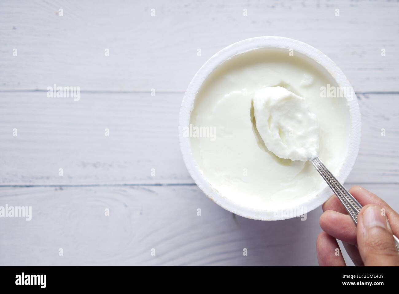 fresh yogurt in a bowl on table Stock Photo - Alamy