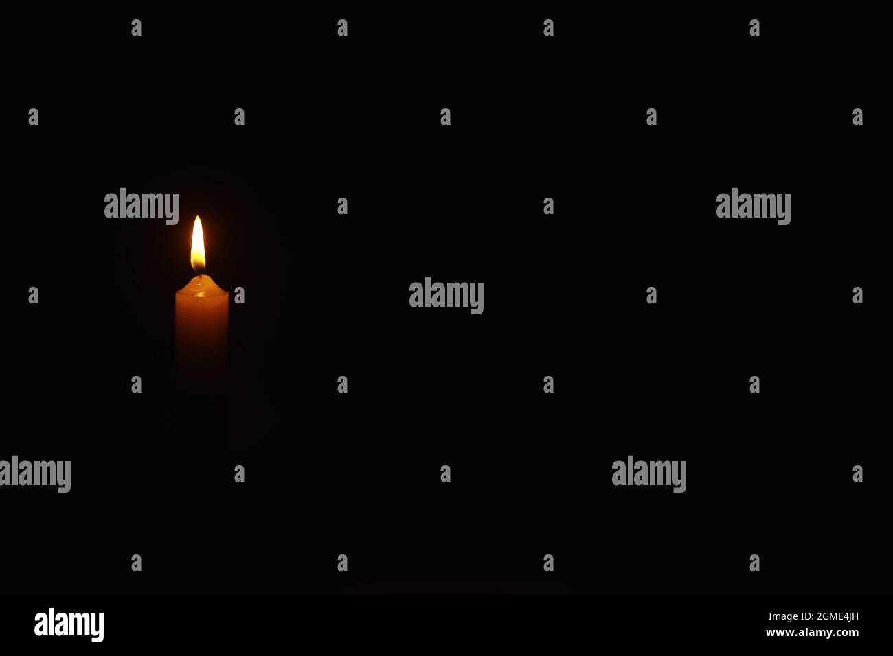 Burning candle Wick from a candle in flame of fire. Symbol of sadness ...