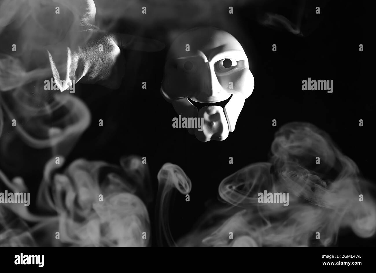 White scary mask on a black background with whites hands Stock Photo ...