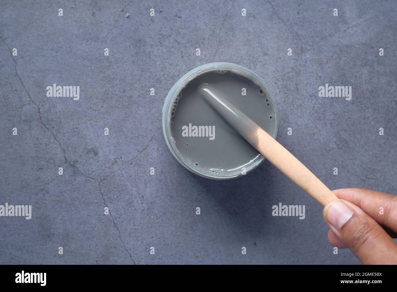 bubble clay mask in container on black background Stock Photo - Alamy