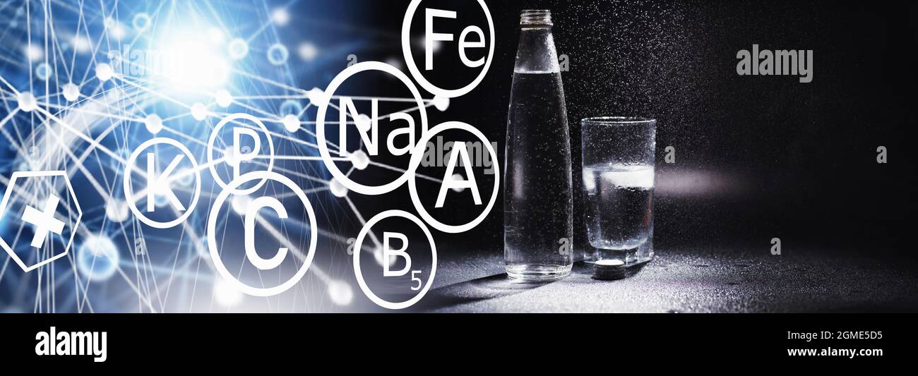 Close up pouring purified fresh drink water from bottle on table in ...