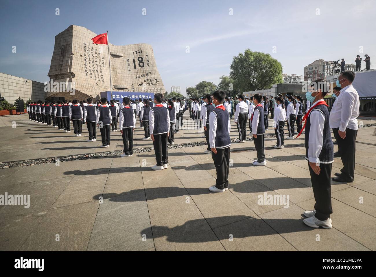 Shenyang, China. 18th Sep, 2021. People attend a bell-tolling ceremony ...