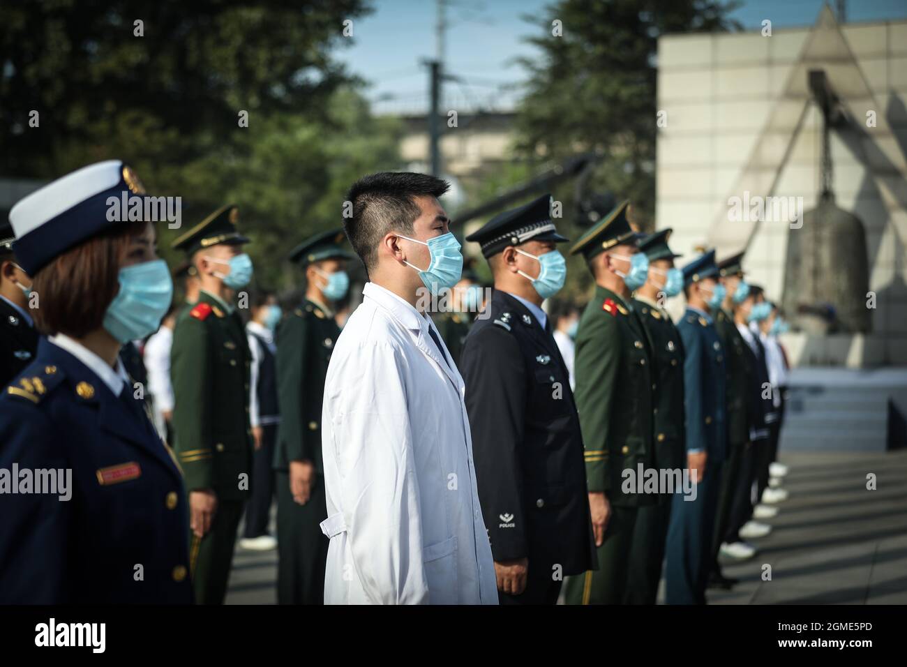 Shenyang, China. 18th Sep, 2021. People attend a bell-tolling ceremony ...