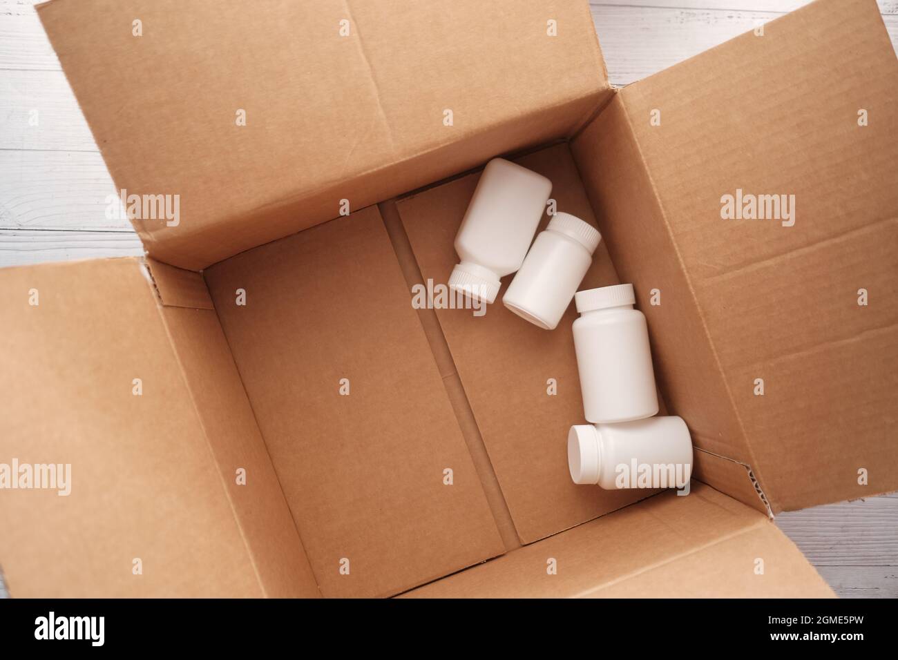 medical pill containers in open a box Stock Photo - Alamy
