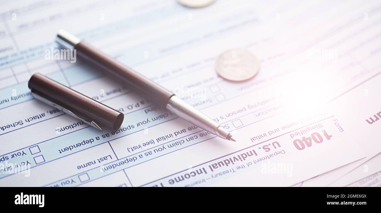 Annual tax reporting. Tax form on the table. Financial statements ...