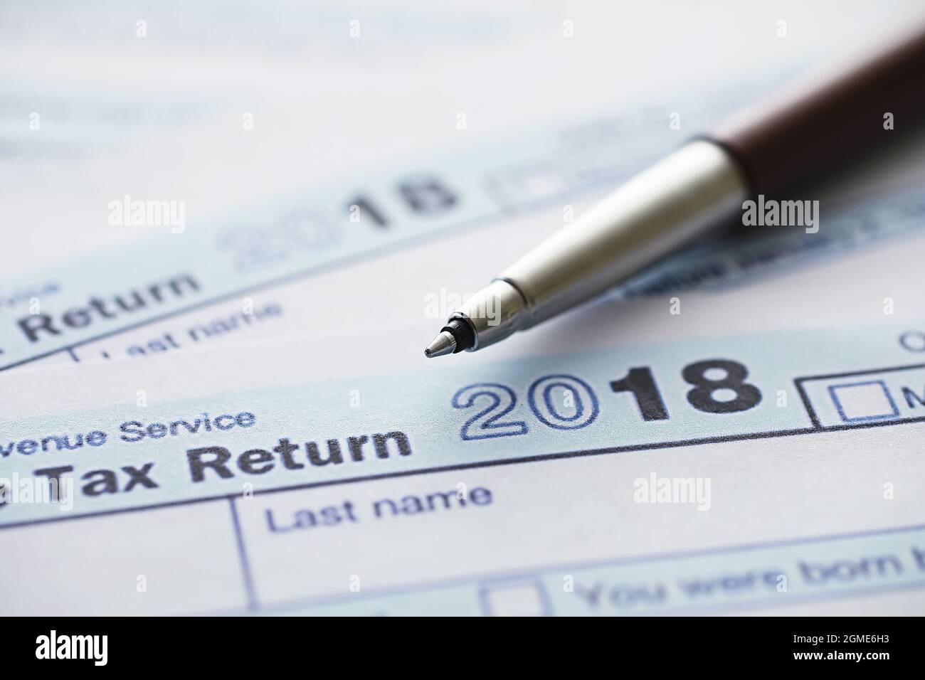 Annual tax reporting. Tax form on the table. Financial statements ...
