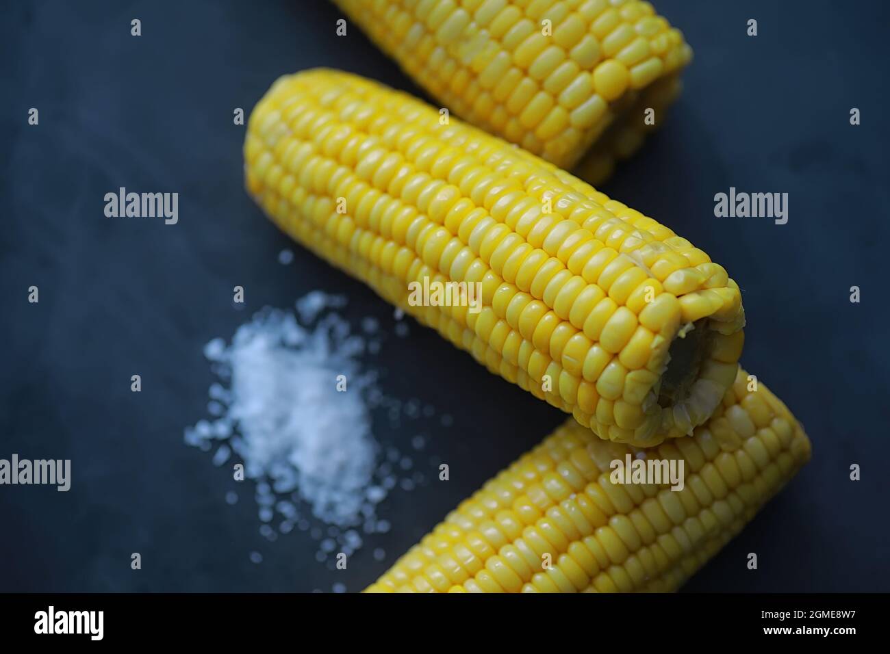 Freshly made fragrant ear of corn with salt. Farm snack fresh corn ...