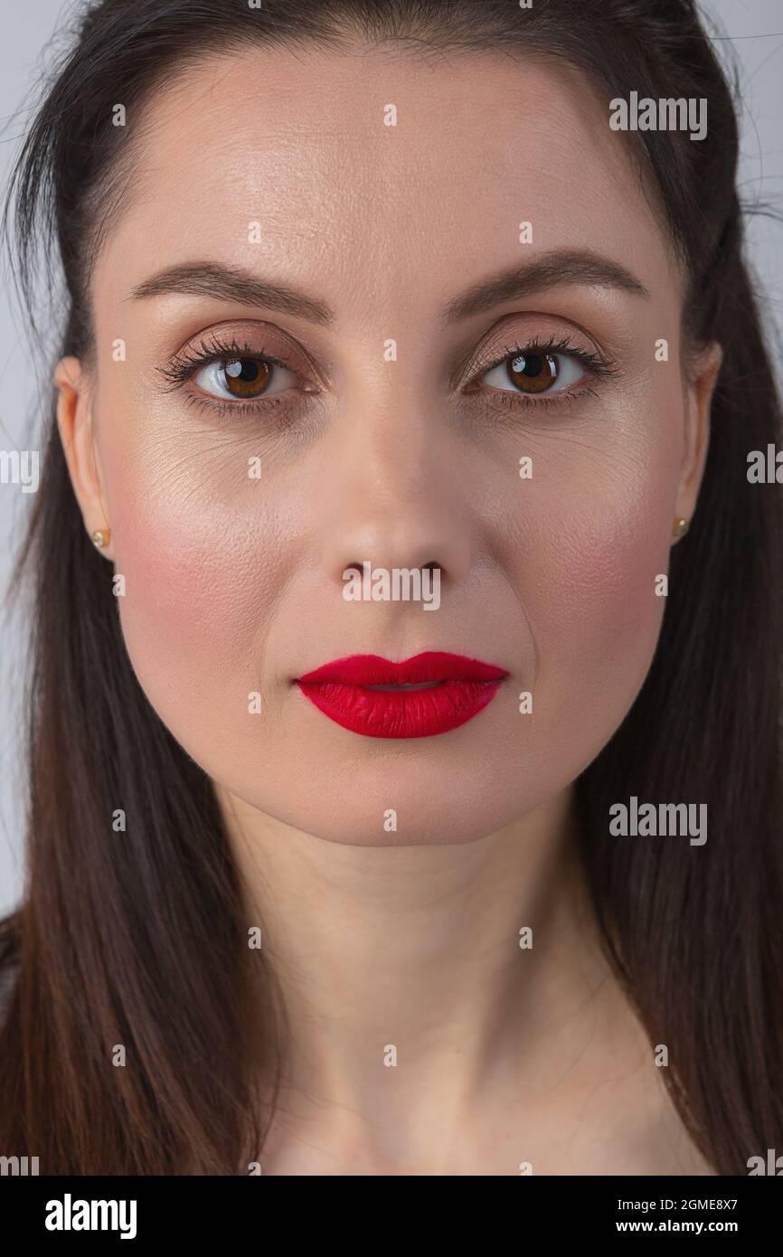 Beautiful brunette fashion model in 30s with red lips and evening ...