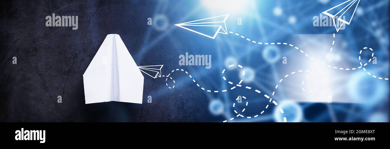 Paper airplane on the table. Origami model on a dark background ...