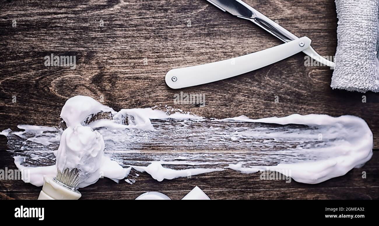 Shaving accessories on a wooden texture background. Tools. Disposable ...