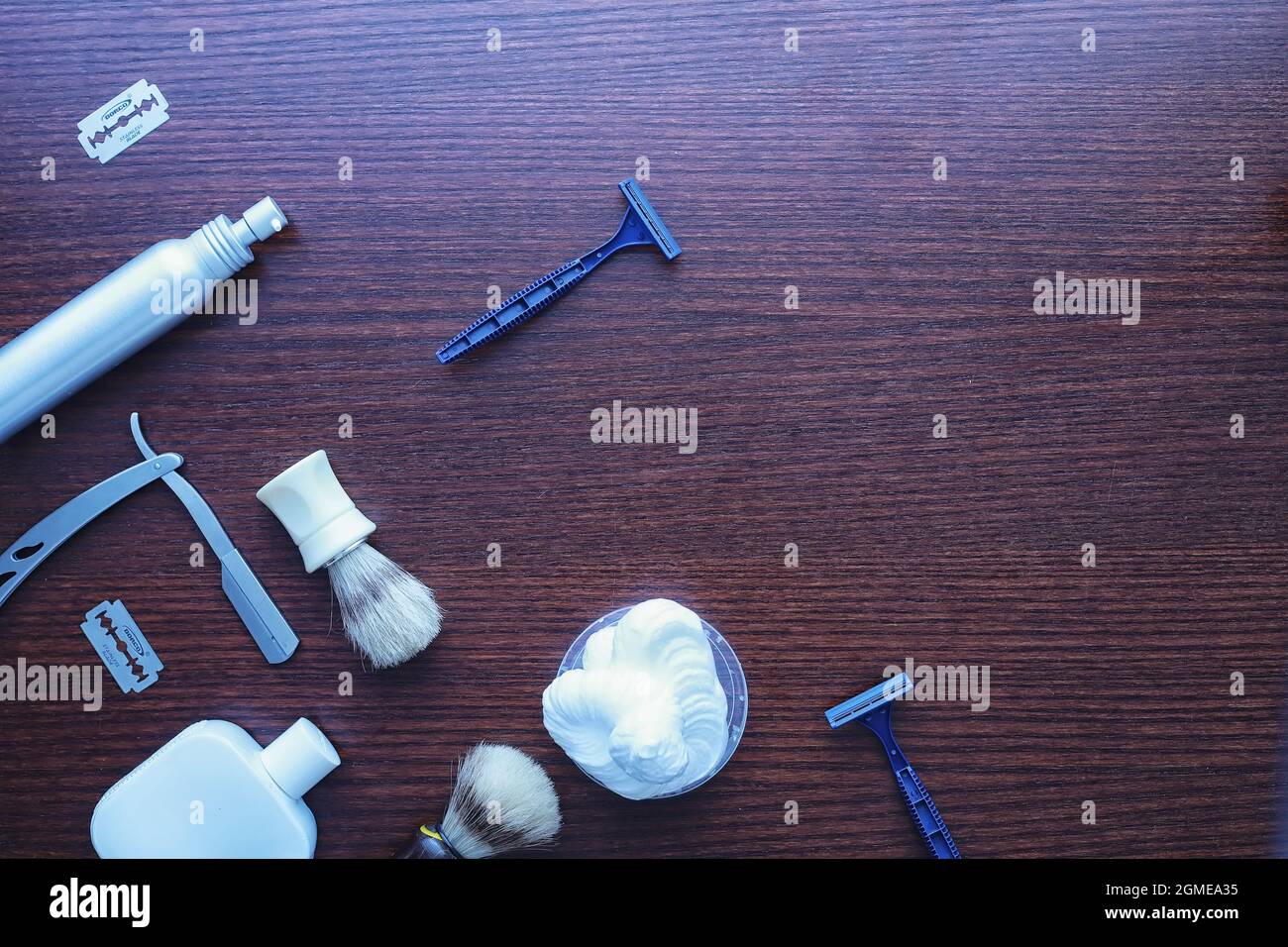 Shaving accessories on a wooden texture background. Tools. Disposable ...