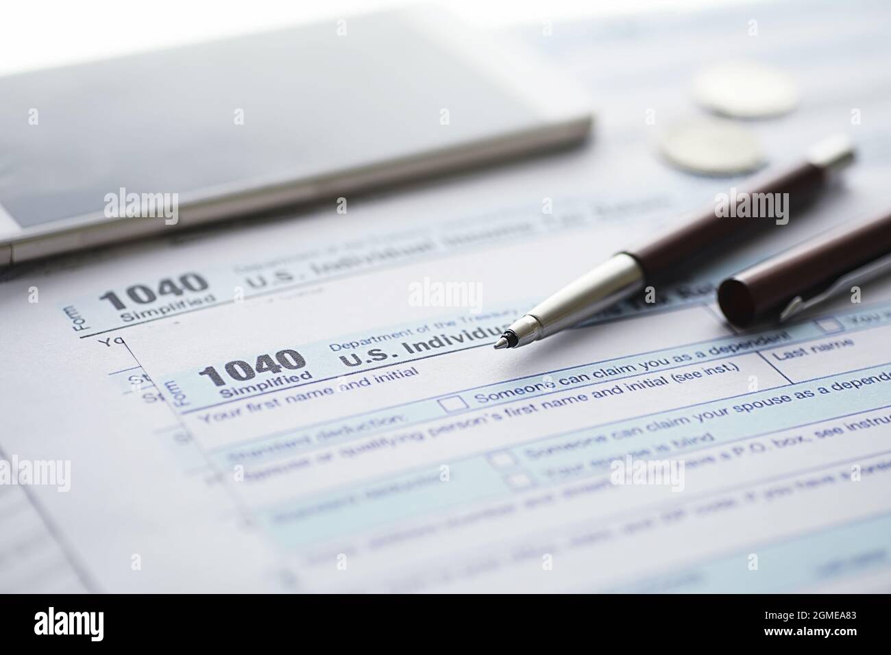 Annual tax reporting. Tax form on the table. Financial statements ...