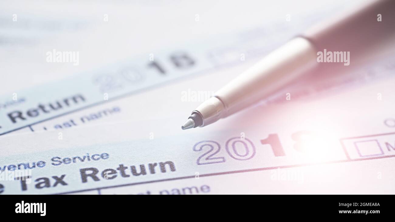 Annual tax reporting. Tax form on the table. Financial statements ...