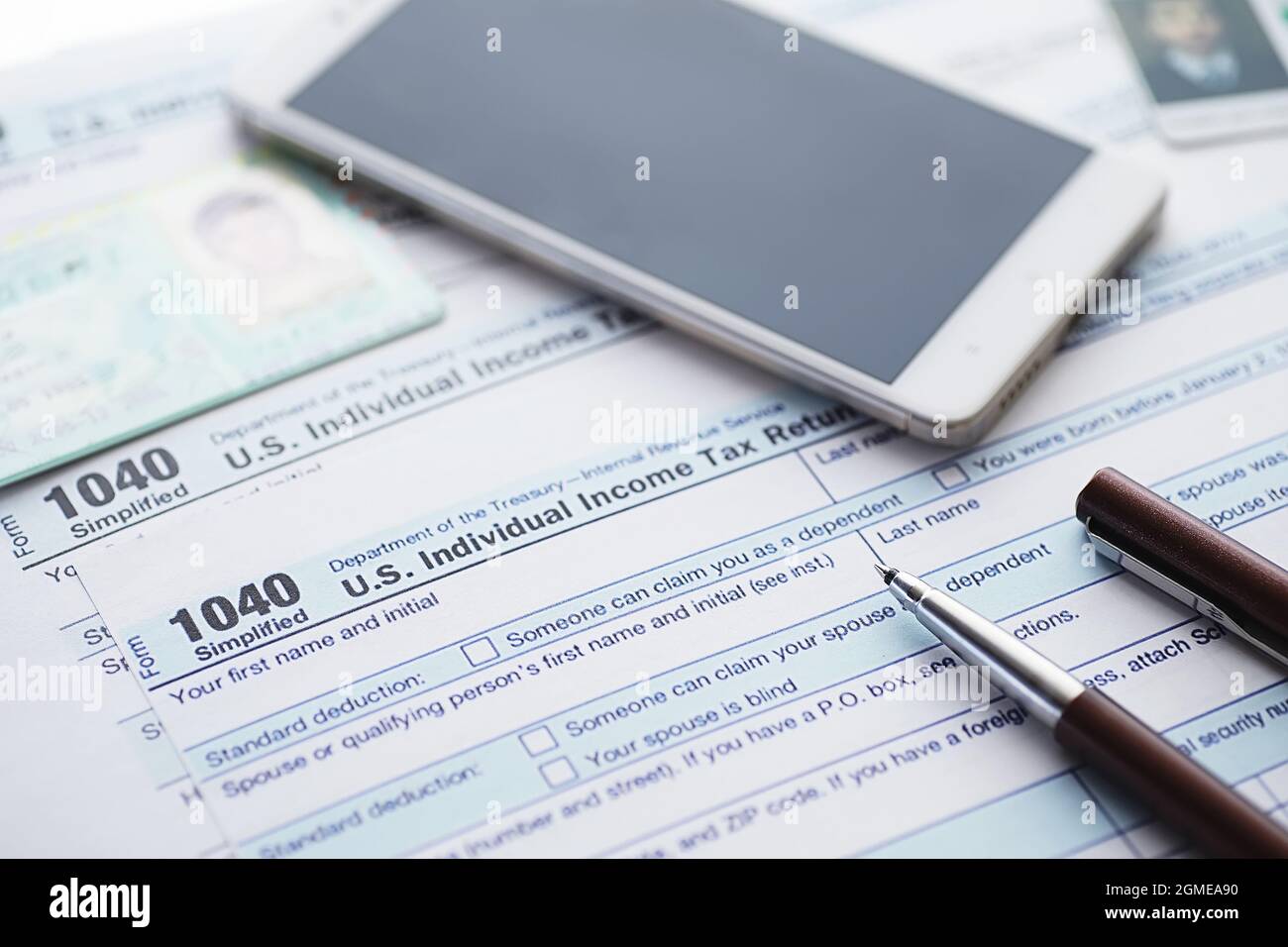 Annual tax reporting. Tax form on the table. Financial statements ...