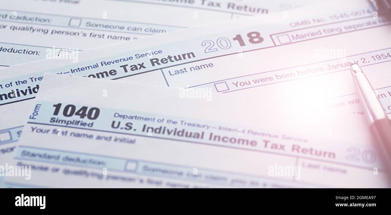 Annual tax reporting. Tax form on the table. Financial statements ...