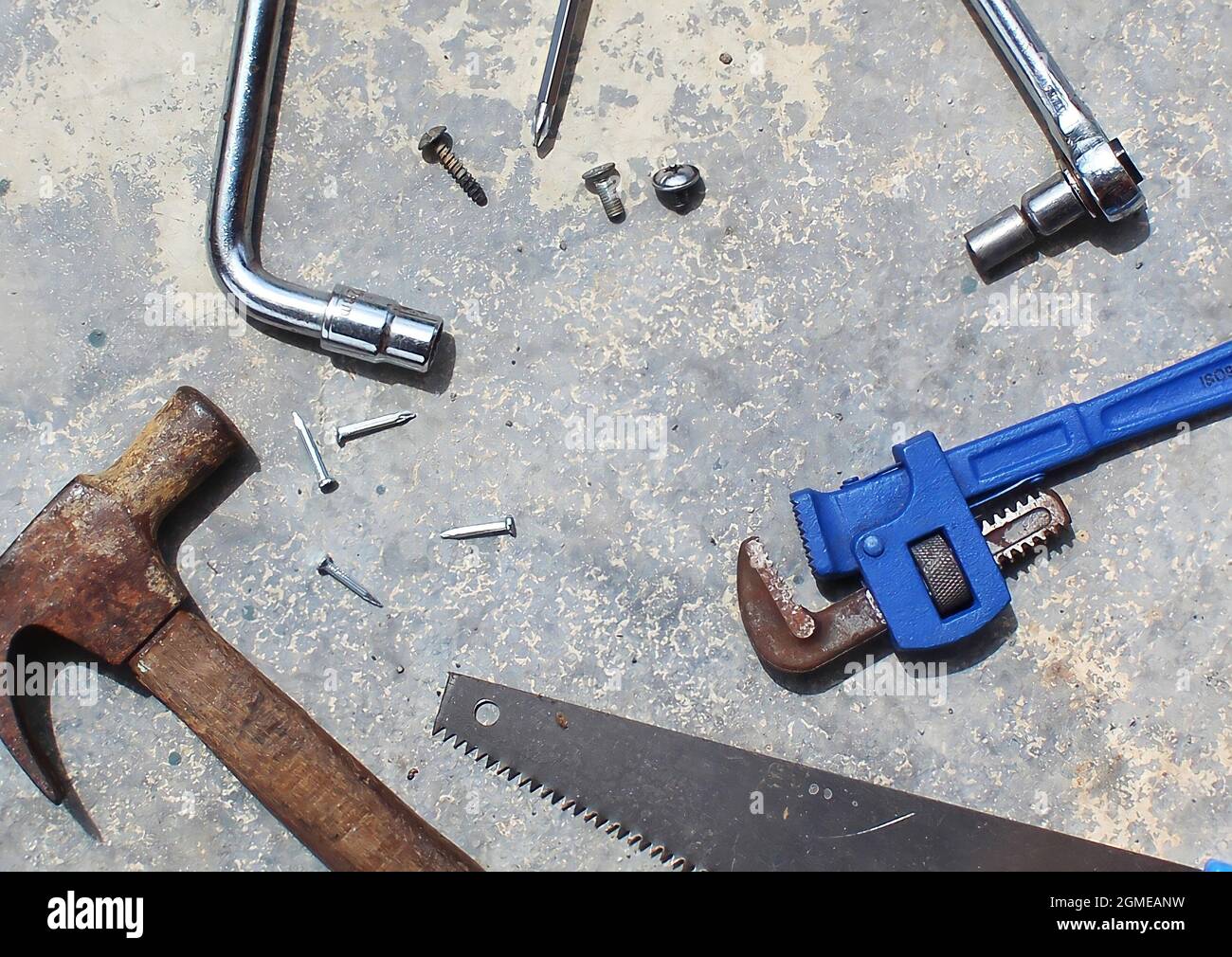 Top view of hardware tools on concrete floor with copy space for text ...