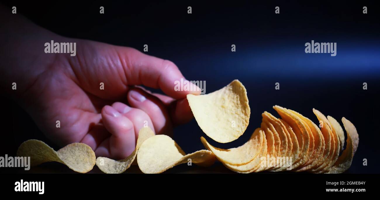 Potato and corn chips. Snacks salty appetizer. Harmful products ...