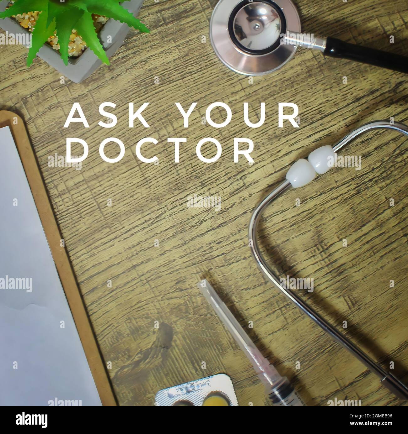 ASK YOUR DOCTOR text surrounded by stethoscope, syringe, tablet and ...