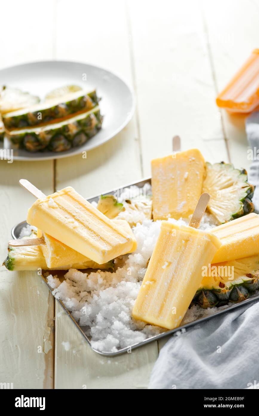 Homemade ice cream or popsicles from pineapple. Frozen fruit pulp ...