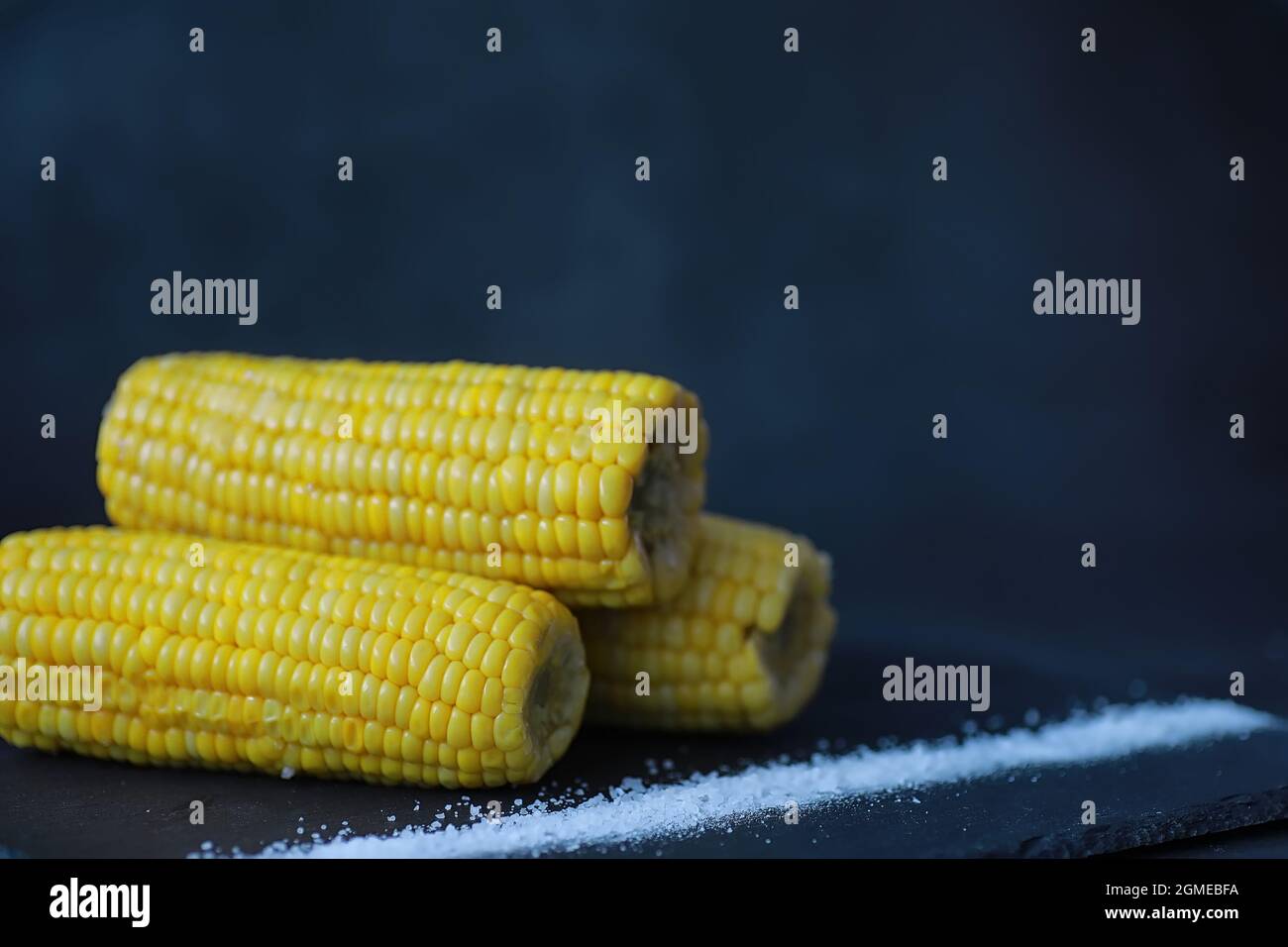 Freshly made fragrant ear of corn with salt. Farm snack fresh corn ...