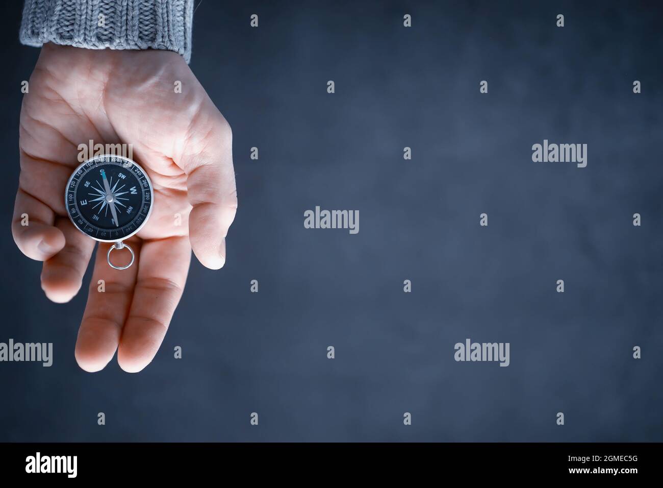 Travel concept. Magnetic compass in the hand. Retro navigator in hand ...