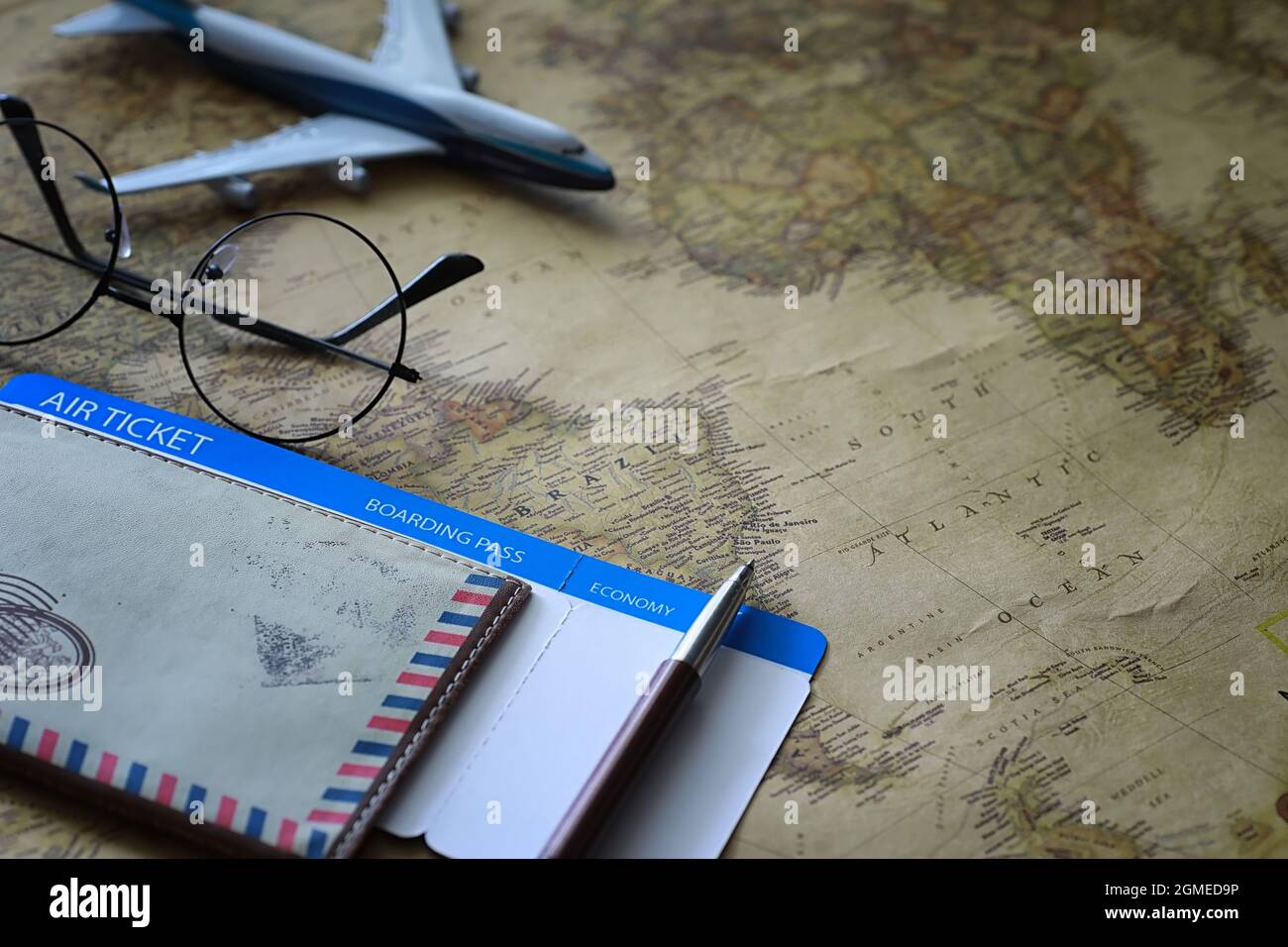 Travel concept. Map on the table and model aircraft Stock Photo - Alamy
